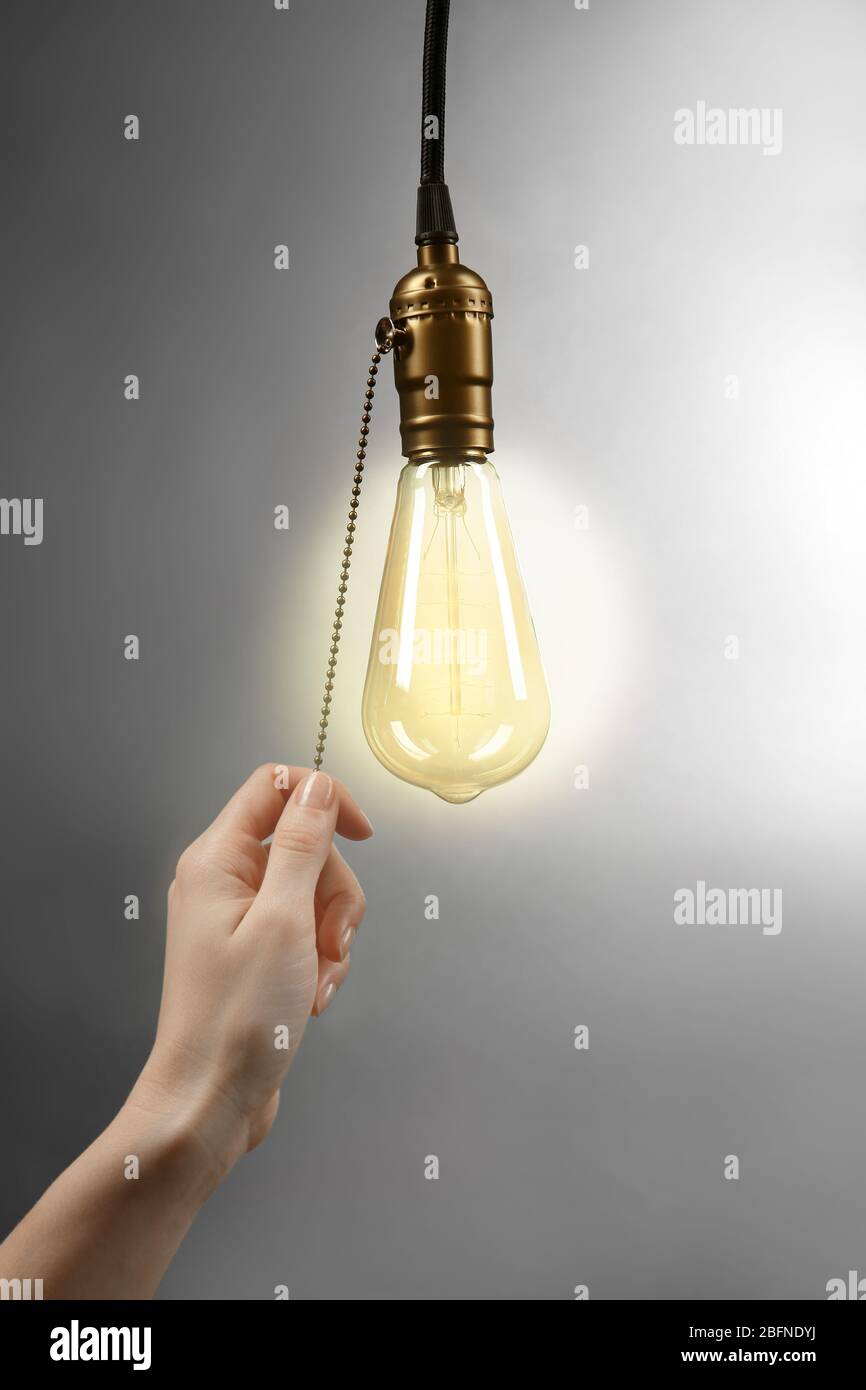 Hand turning on light hi-res stock photography and images - Alamy