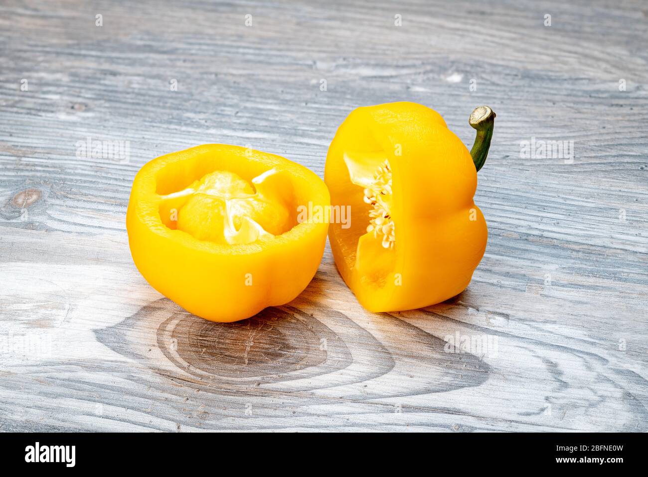Bell pepper cut in half showing what’s inside Stock Photo - Alamy