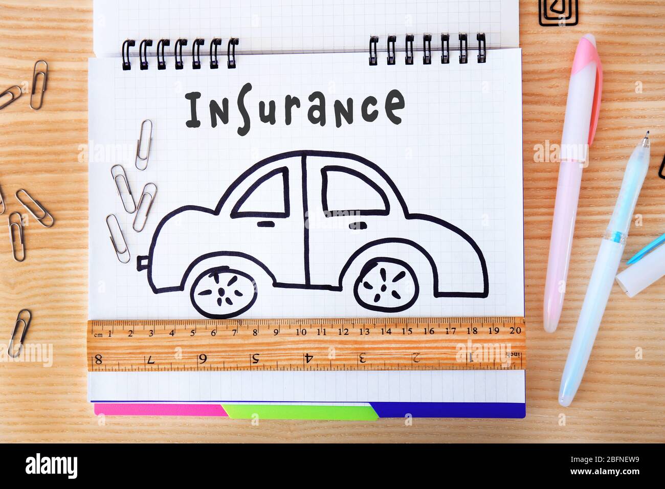 Car insurance concept. Car drawing in notebook Stock Photo - Alamy