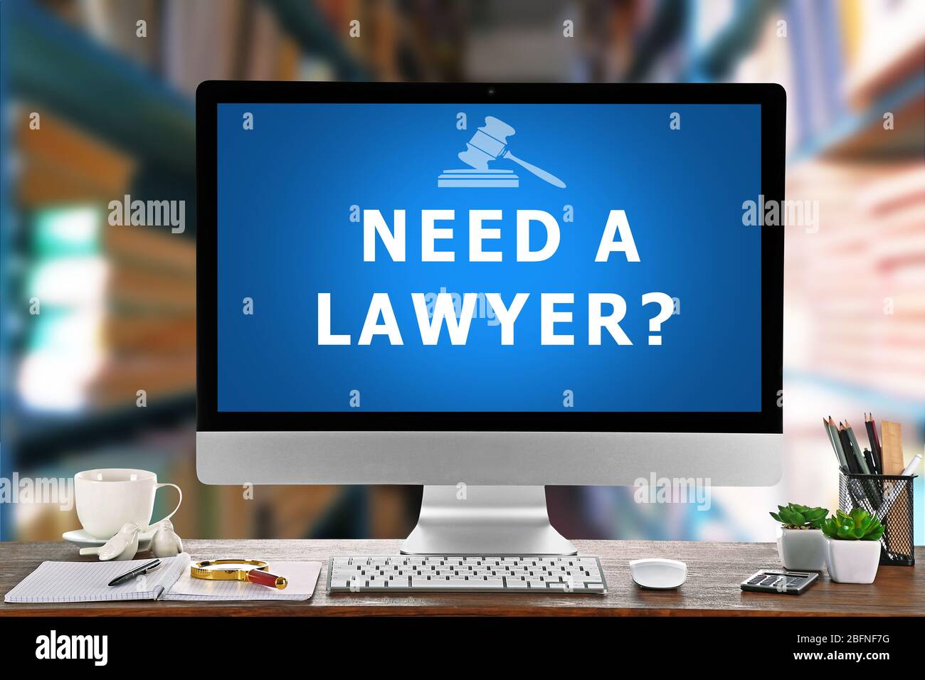 Modern computer on table. Text NEED A LAWYER? on screen Stock Photo - Alamy