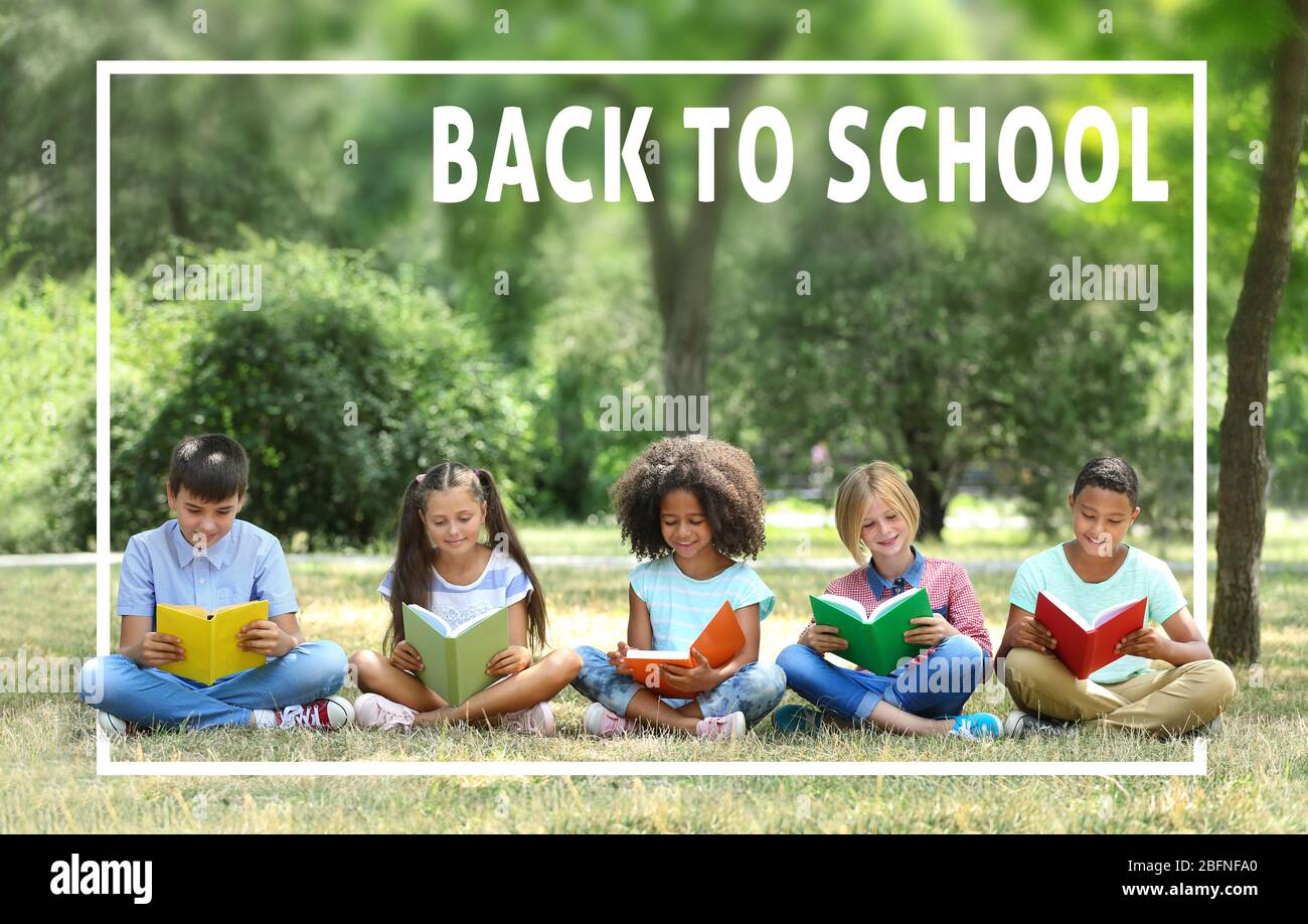 Cute kids reading books at park. Text BACK TO SCHOOL on background ...