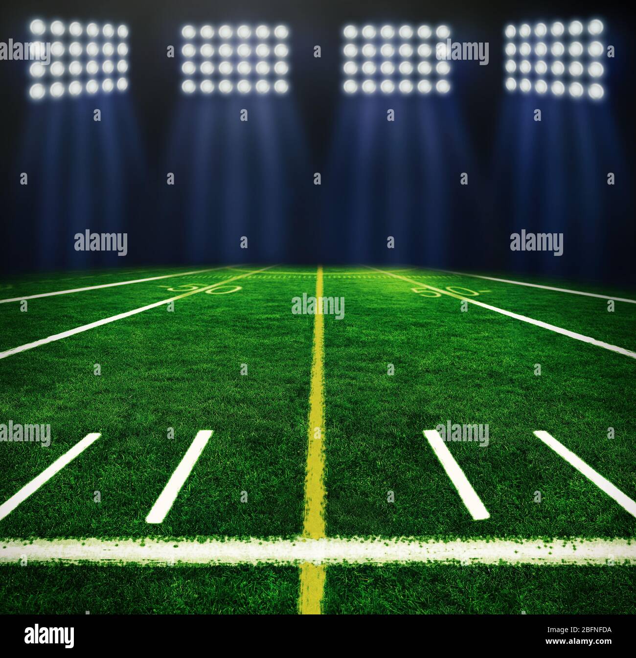 Illuminated football field at night Stock Photo - Alamy