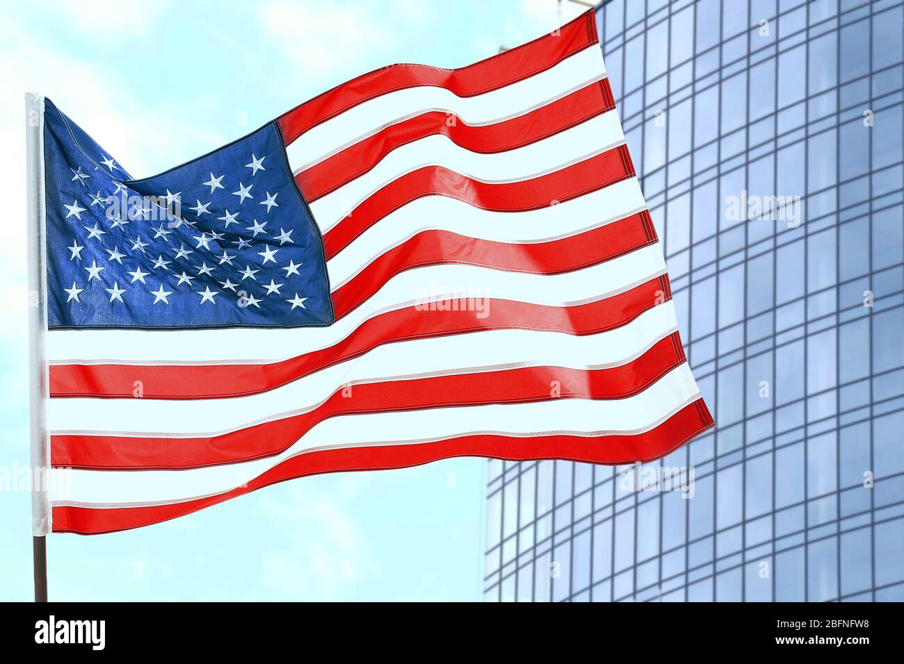 American flag on building background Stock Photo - Alamy