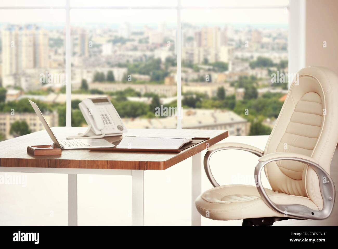 Modern office interior and cityscape view through window Stock Photo ...