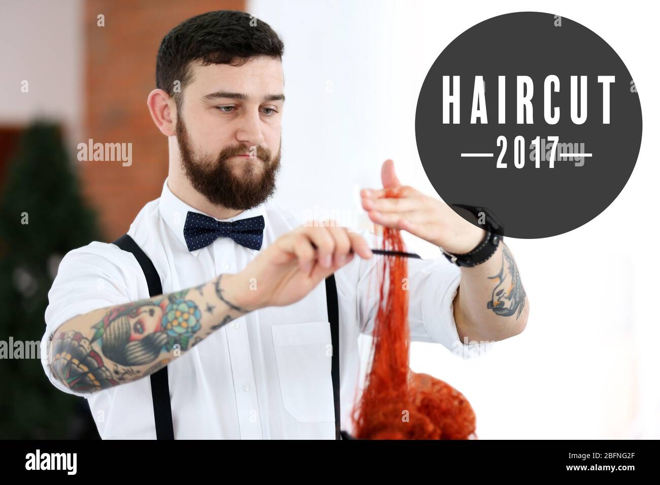 Text HAIRCUT 2017 on background. Hairdresser working with client at ...