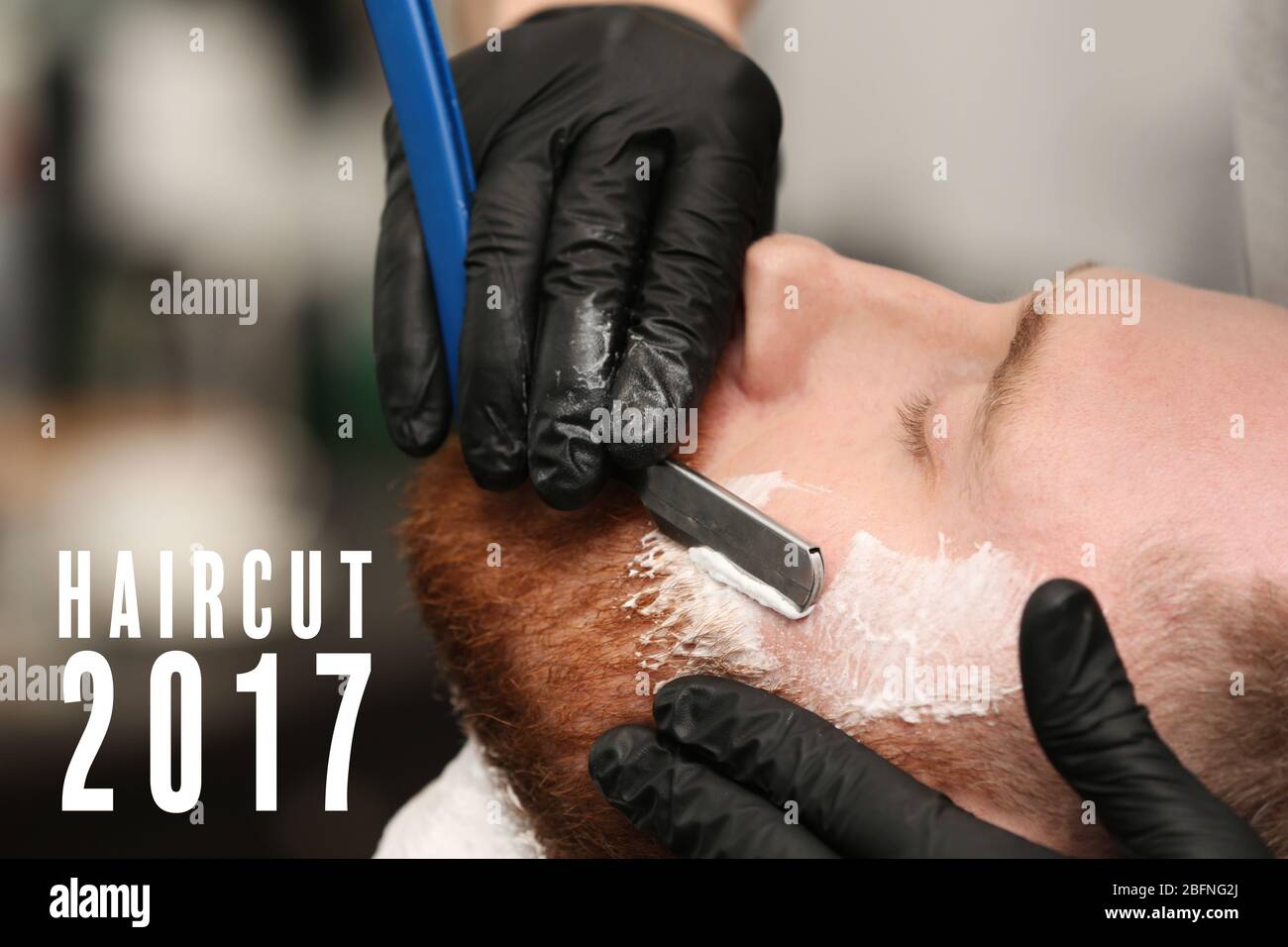 Text HAIRCUT 2017 on background. Man at barber shop Stock Photo - Alamy