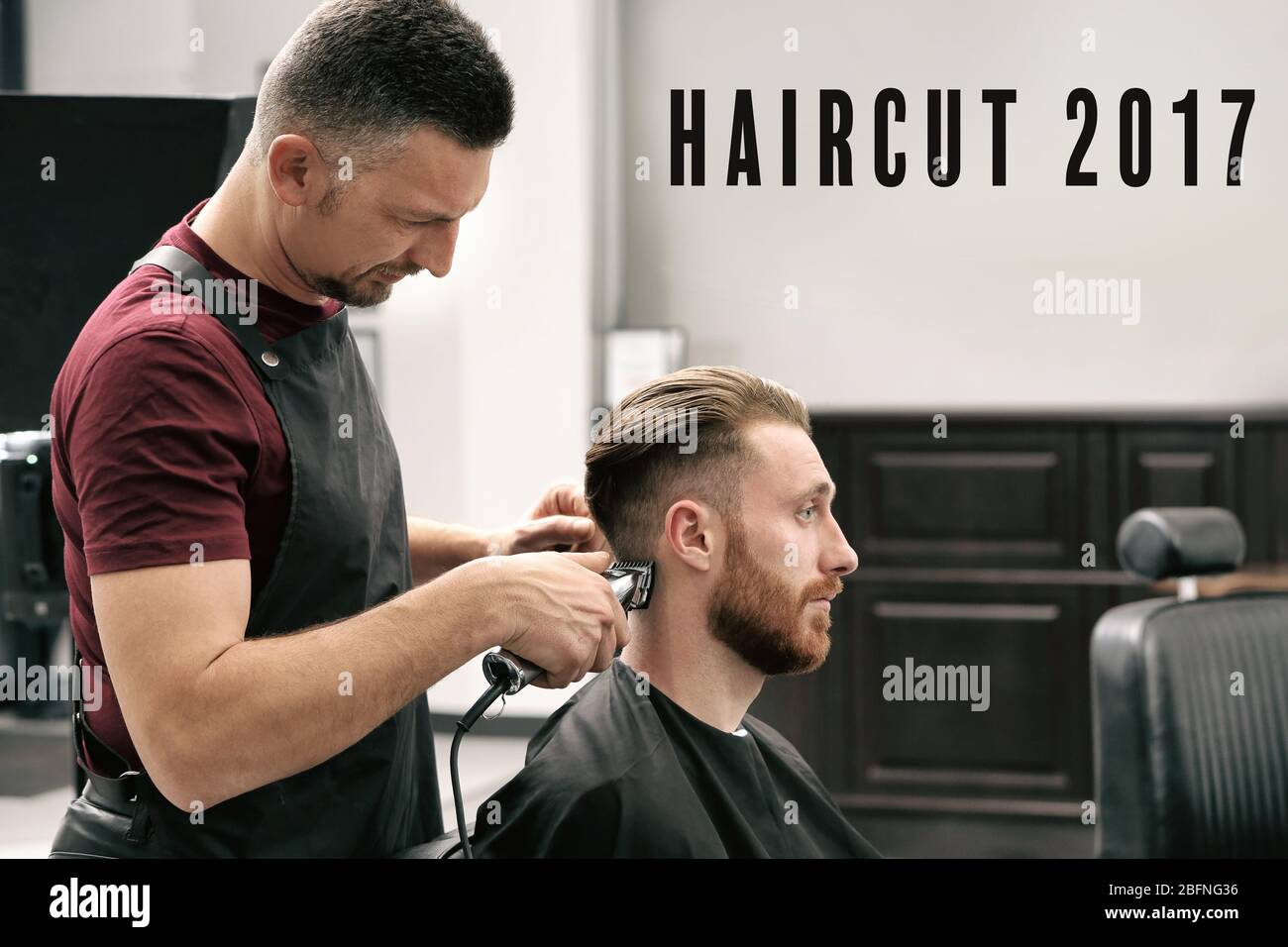Text HAIRCUT 2017 on background. Man at barber shop Stock Photo - Alamy