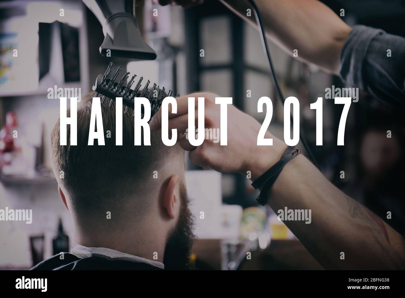 Text HAIRCUT 2017 on background. Man at barber shop Stock Photo - Alamy