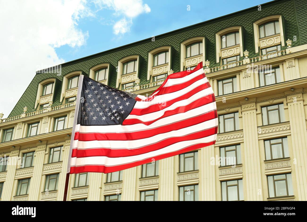 American flag on building background Stock Photo - Alamy