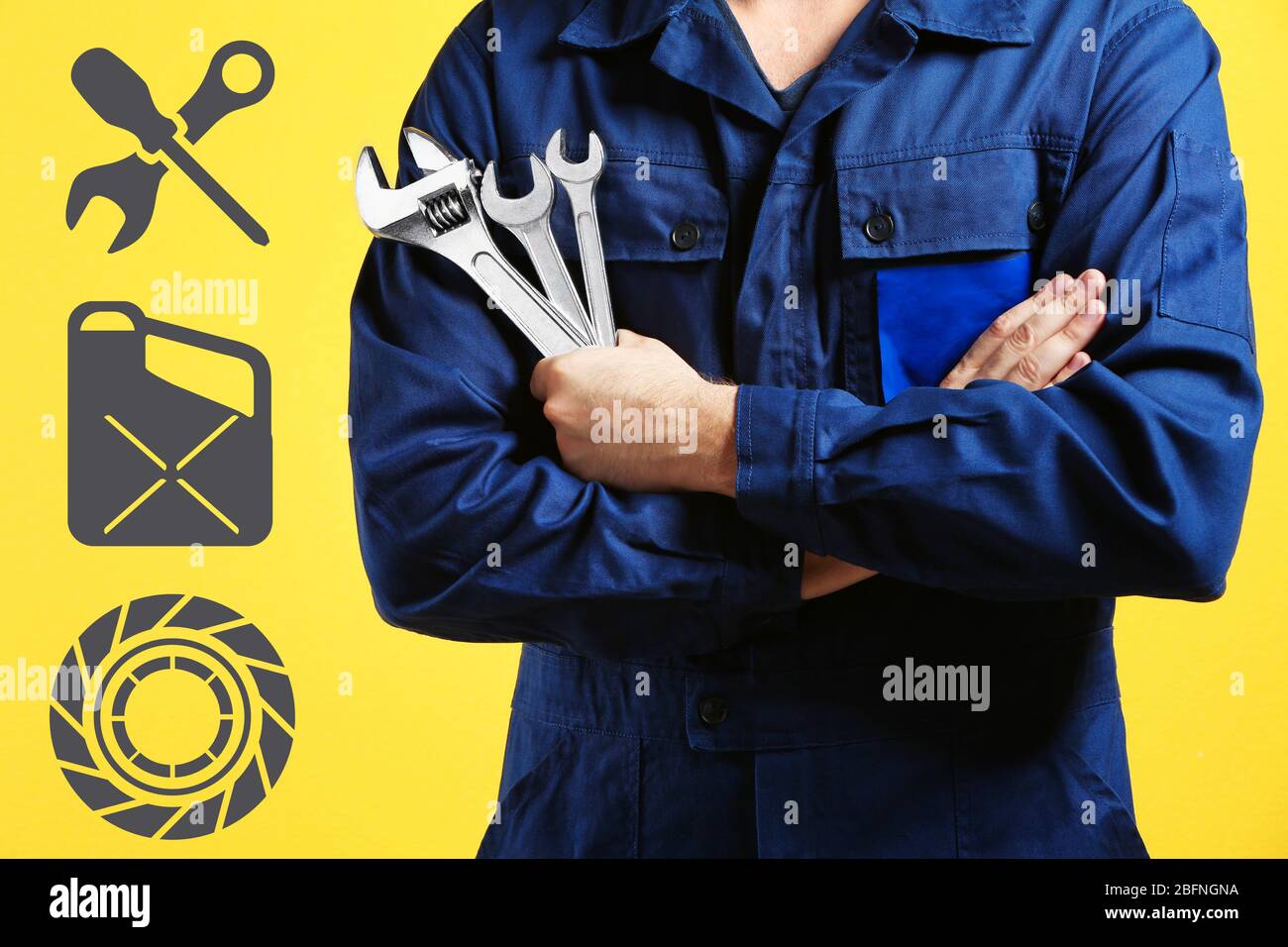 Car service concept. Man with equipment on yellow background Stock ...