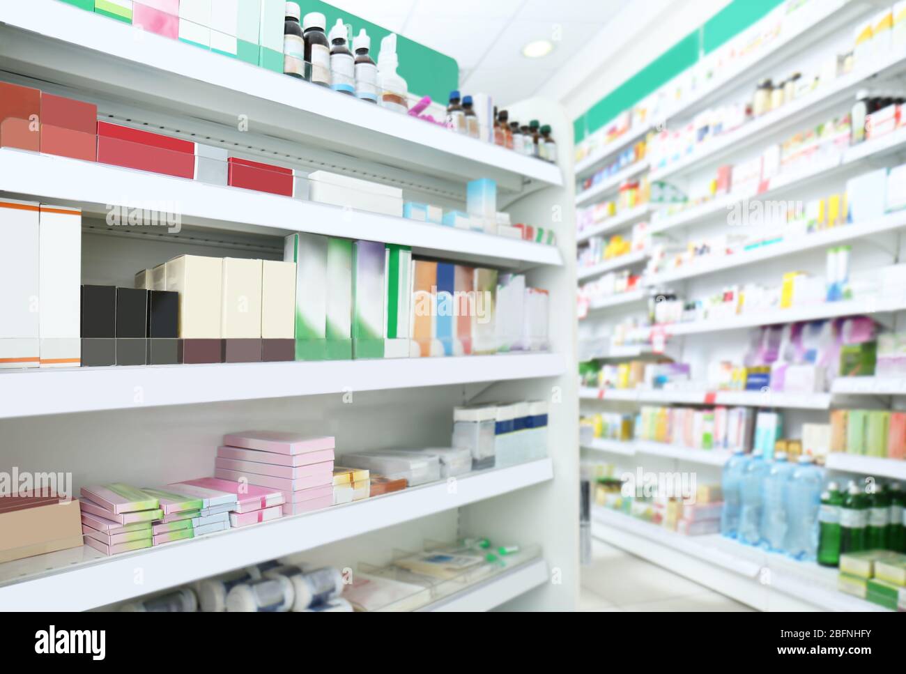Various products on shelves at store Stock Photo - Alamy