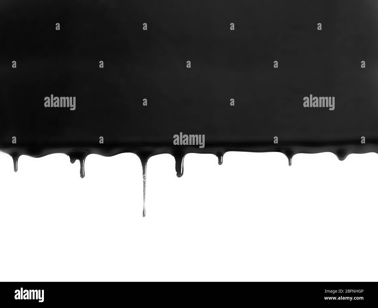 Chocolate syrup on white Black and White Stock Photos & Images - Alamy