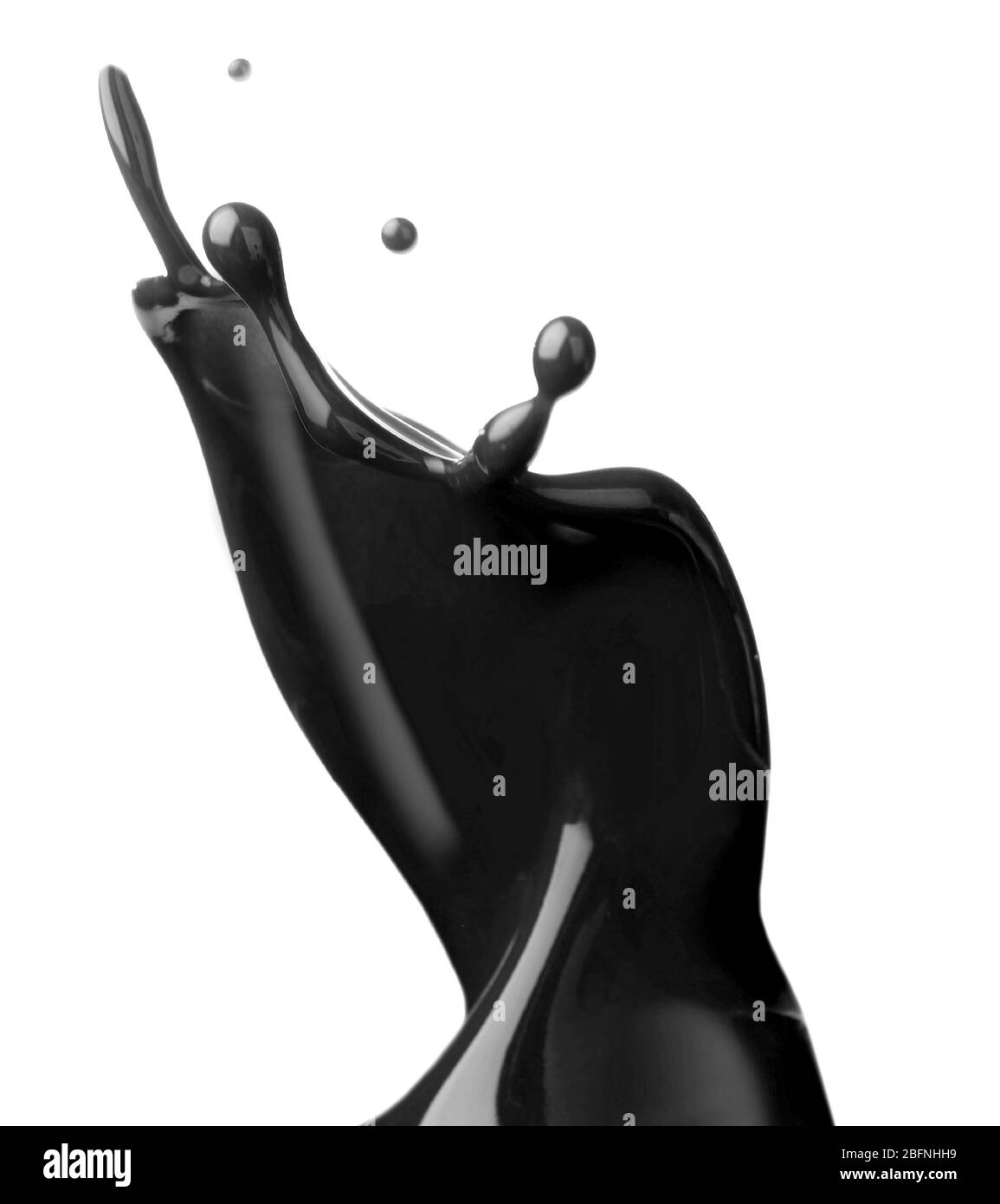 Splash of black fluid on white background Stock Photo - Alamy
