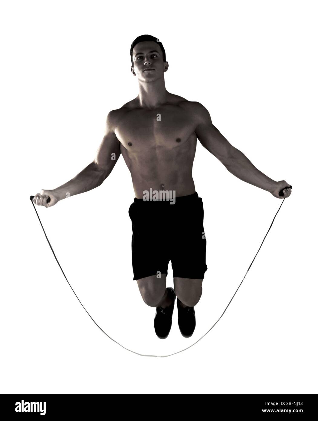 Young man with jumping rope on white background Stock Photo - Alamy