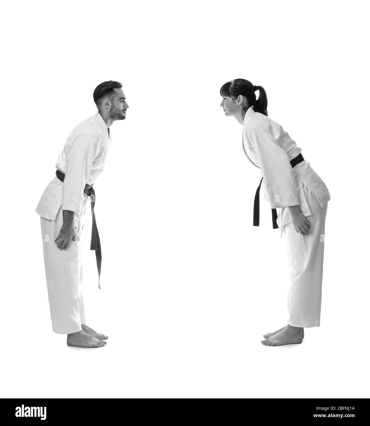 Young people practising karate on white background Stock Photo - Alamy