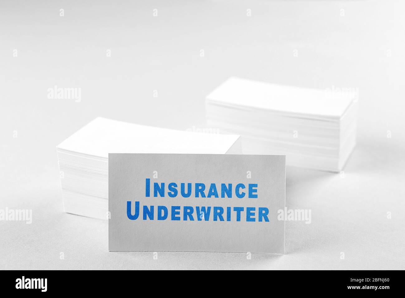 Visiting card of insurance underwriter on light background Stock Photo ...