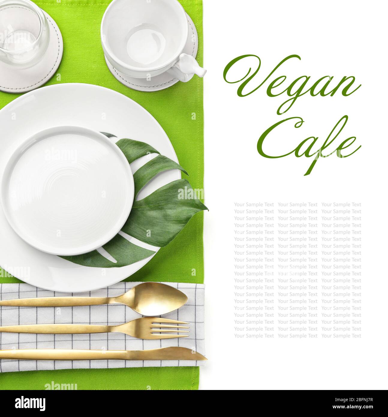 Table setting and text VEGAN CAFE on white background Stock Photo - Alamy