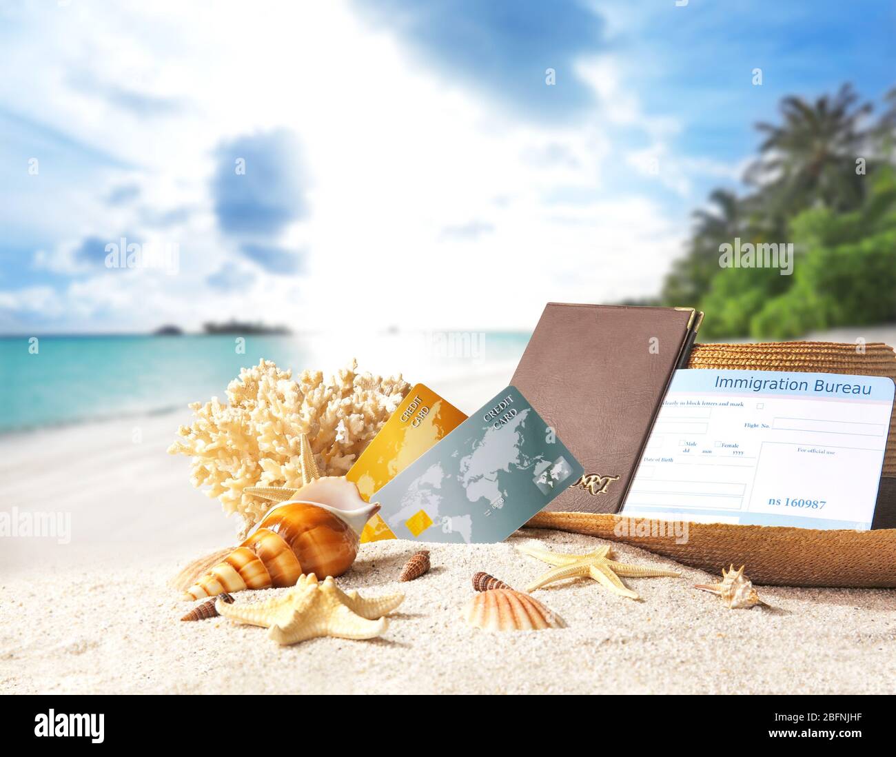 Composition with credit cards on tropical beach Stock Photo - Alamy