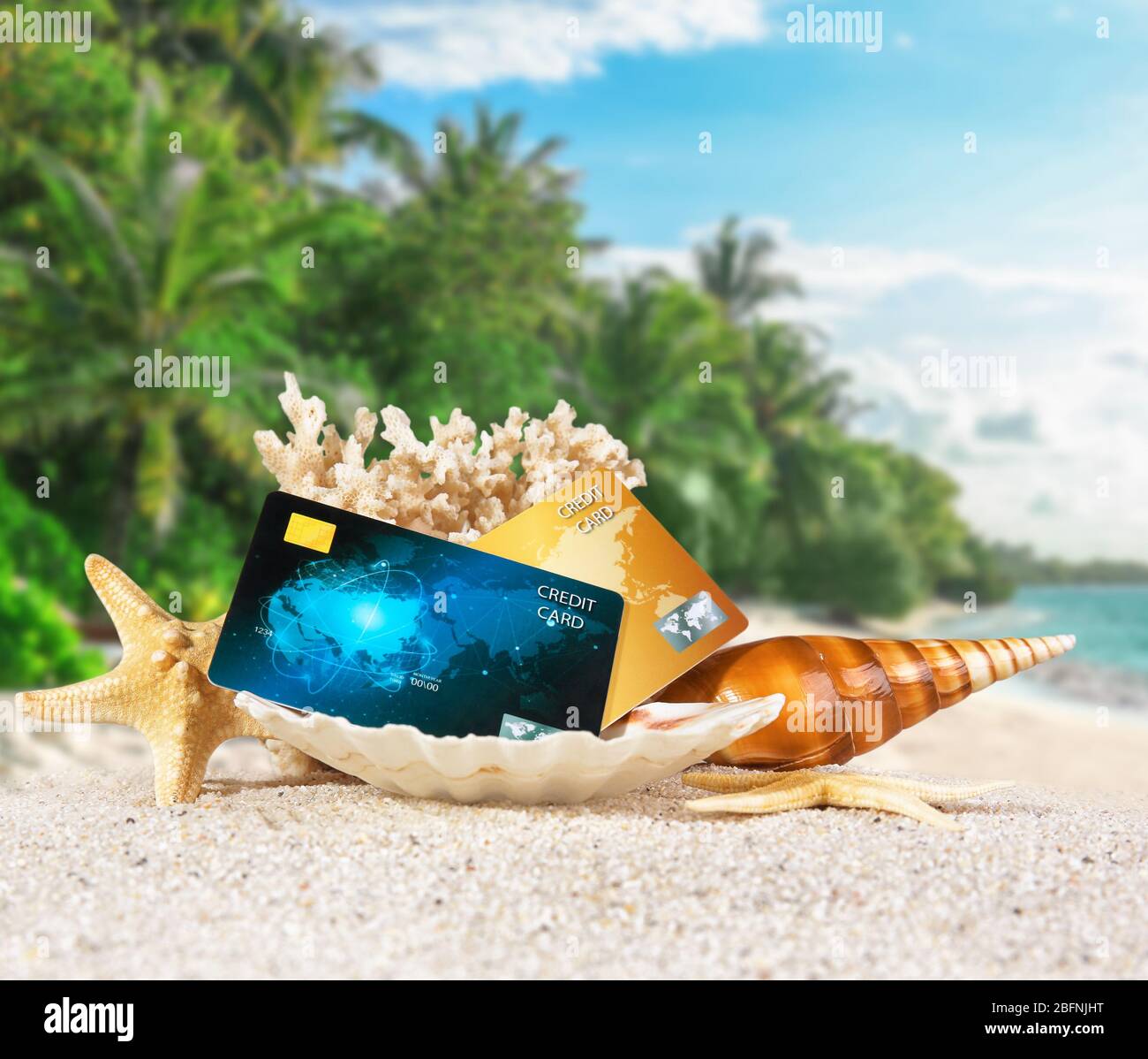 Composition with credit cards on tropical beach Stock Photo - Alamy