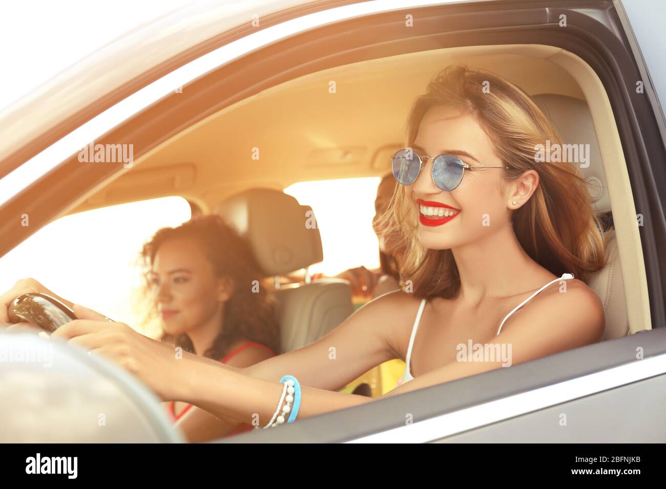 Beautiful young women in car Stock Photo - Alamy
