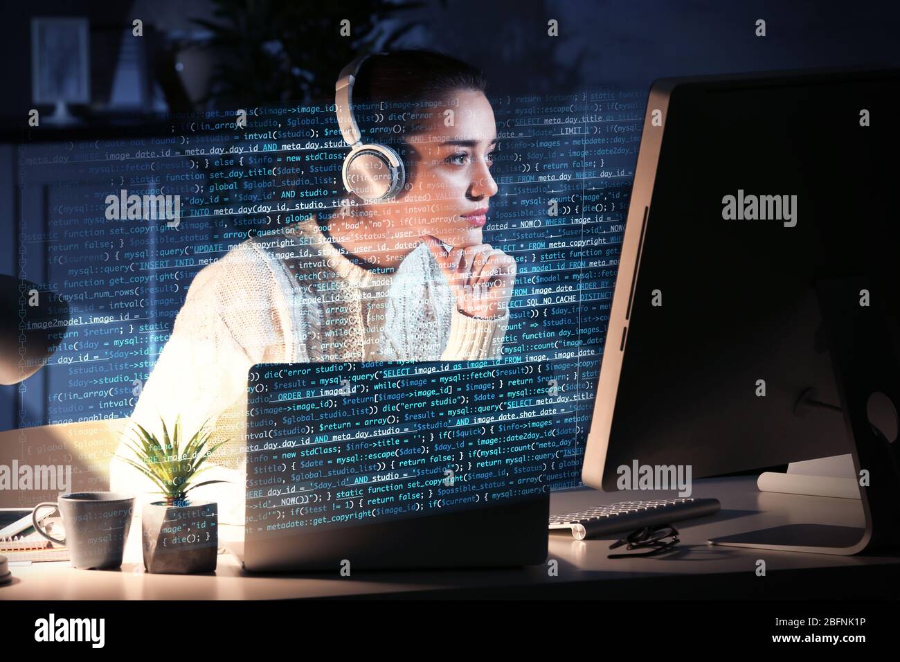 Young woman working with computer at table. Concept of cyber attack ...