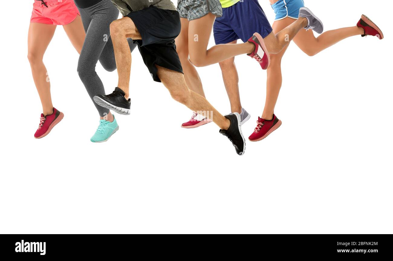 Group of running people on white background Stock Photo - Alamy