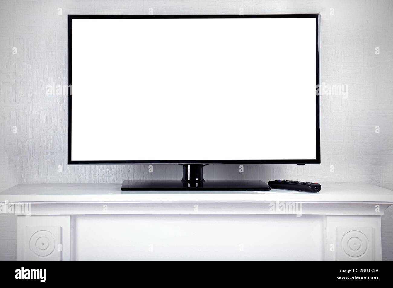 Blank TV display on stand in living room Stock Photo - Alamy