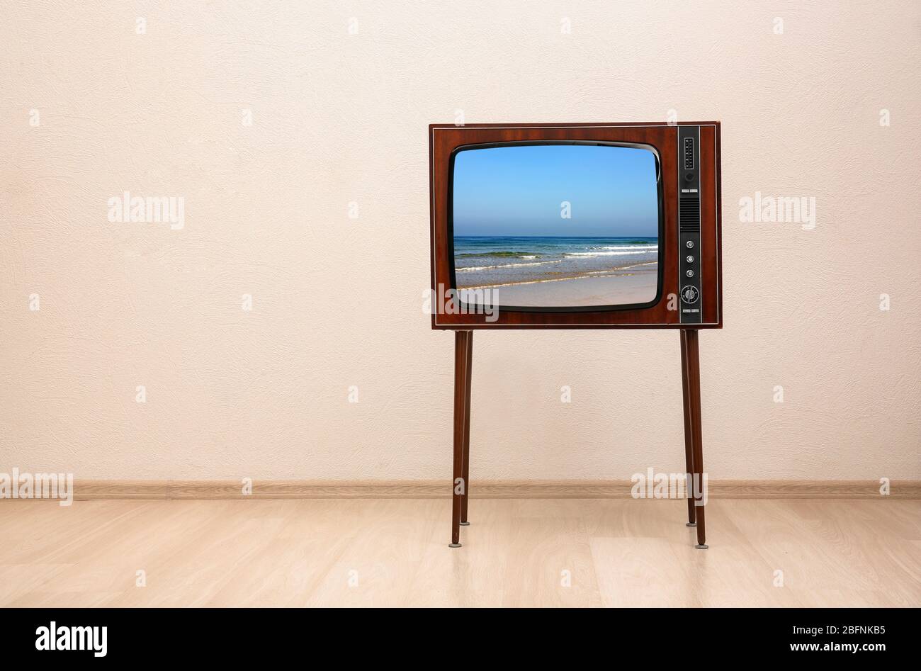 Retro TV in empty room near wall Stock Photo - Alamy