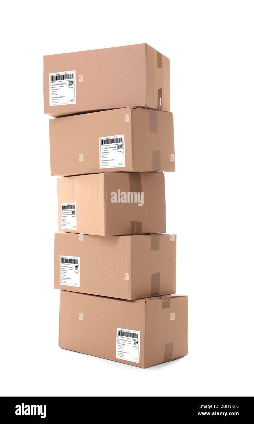 Stacked parcels with tracking codes on white background Stock Photo - Alamy