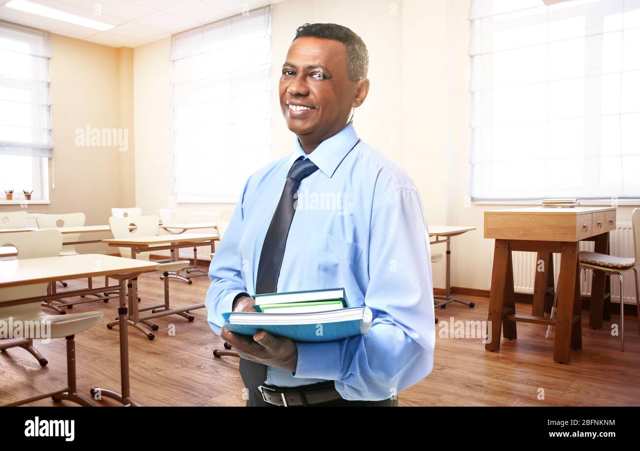 Portrait of teacher in modern class room at school Stock Photo - Alamy