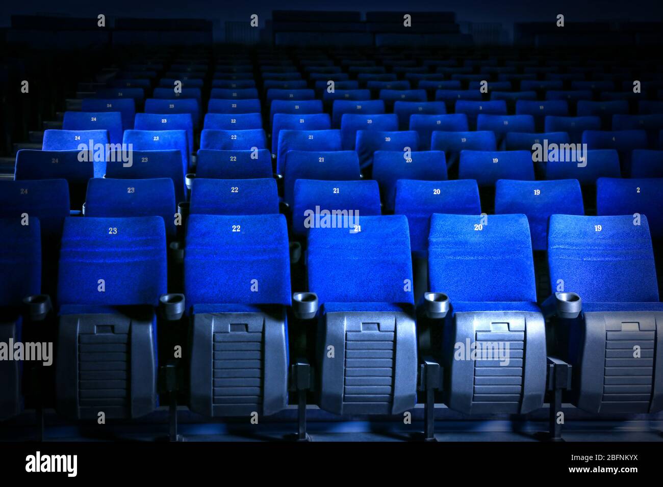 Comfy blue seats in empty cinema hall Stock Photo - Alamy