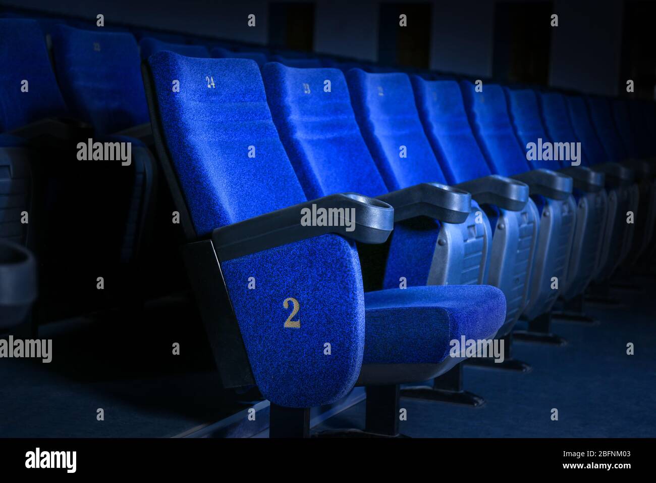 Comfy blue seats in empty cinema hall Stock Photo - Alamy