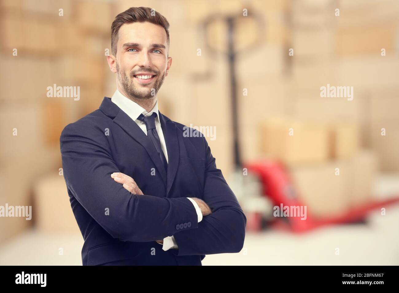 Owner of logistics business in warehouse Stock Photo - Alamy