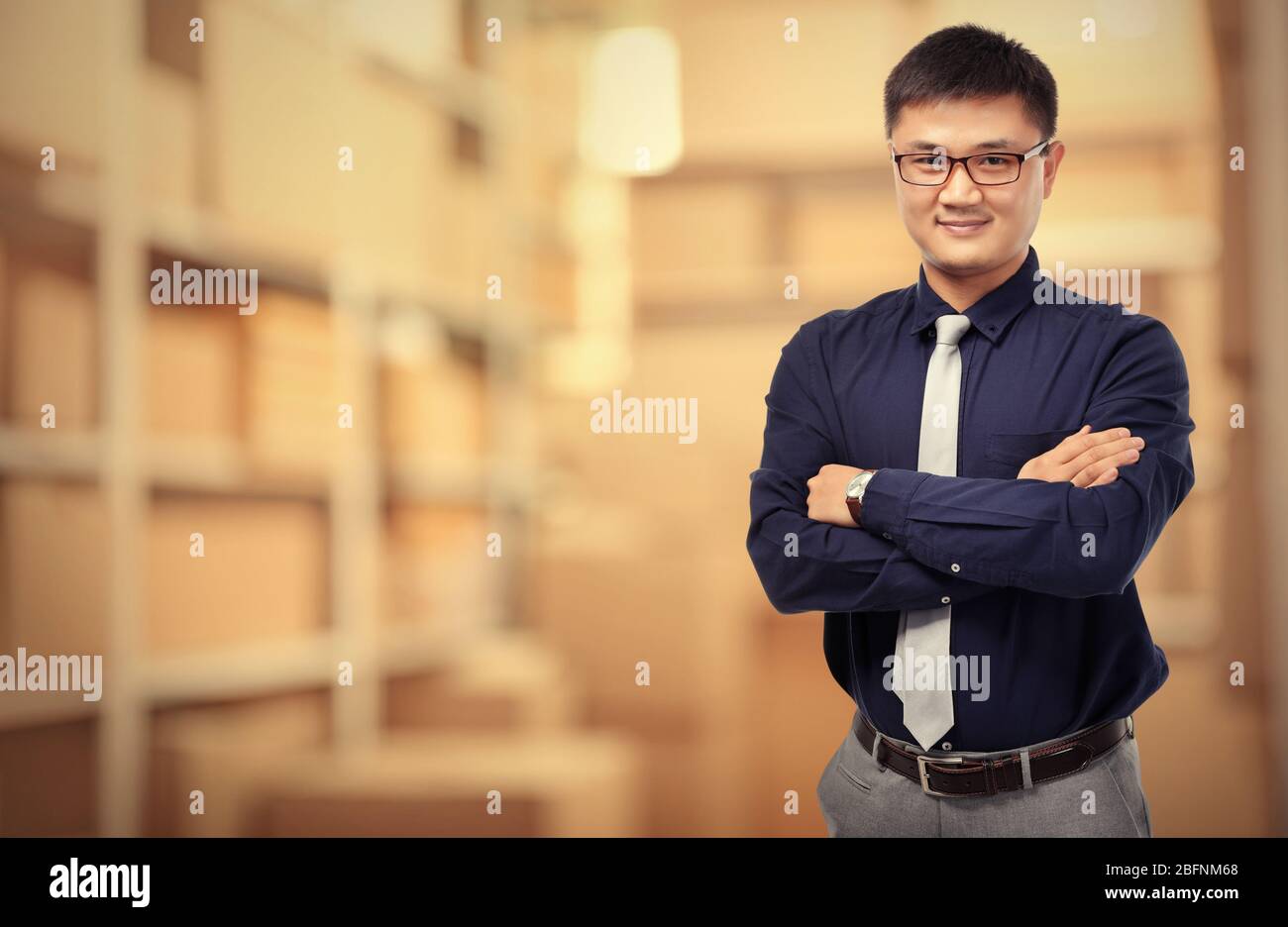 Owner of logistics business in warehouse Stock Photo - Alamy