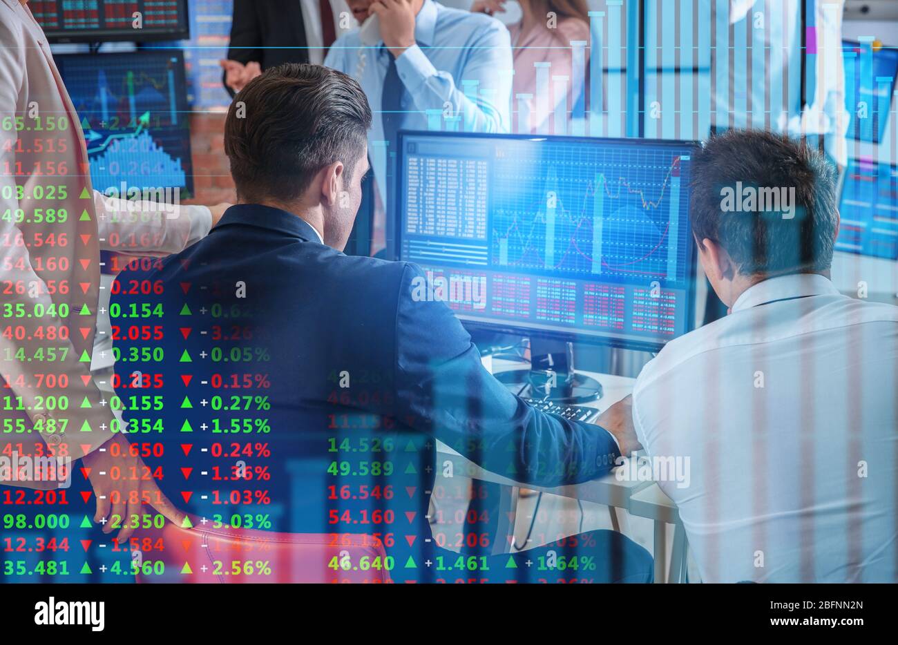 Stock exchange brokers working in office Stock Photo - Alamy