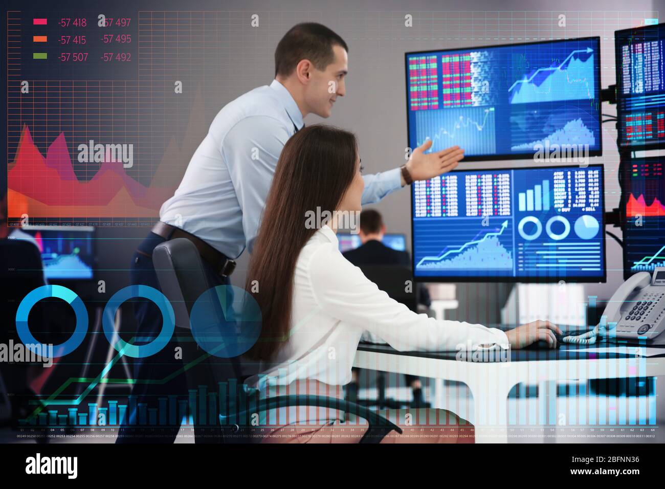 Stock exchange brokers working in office Stock Photo - Alamy
