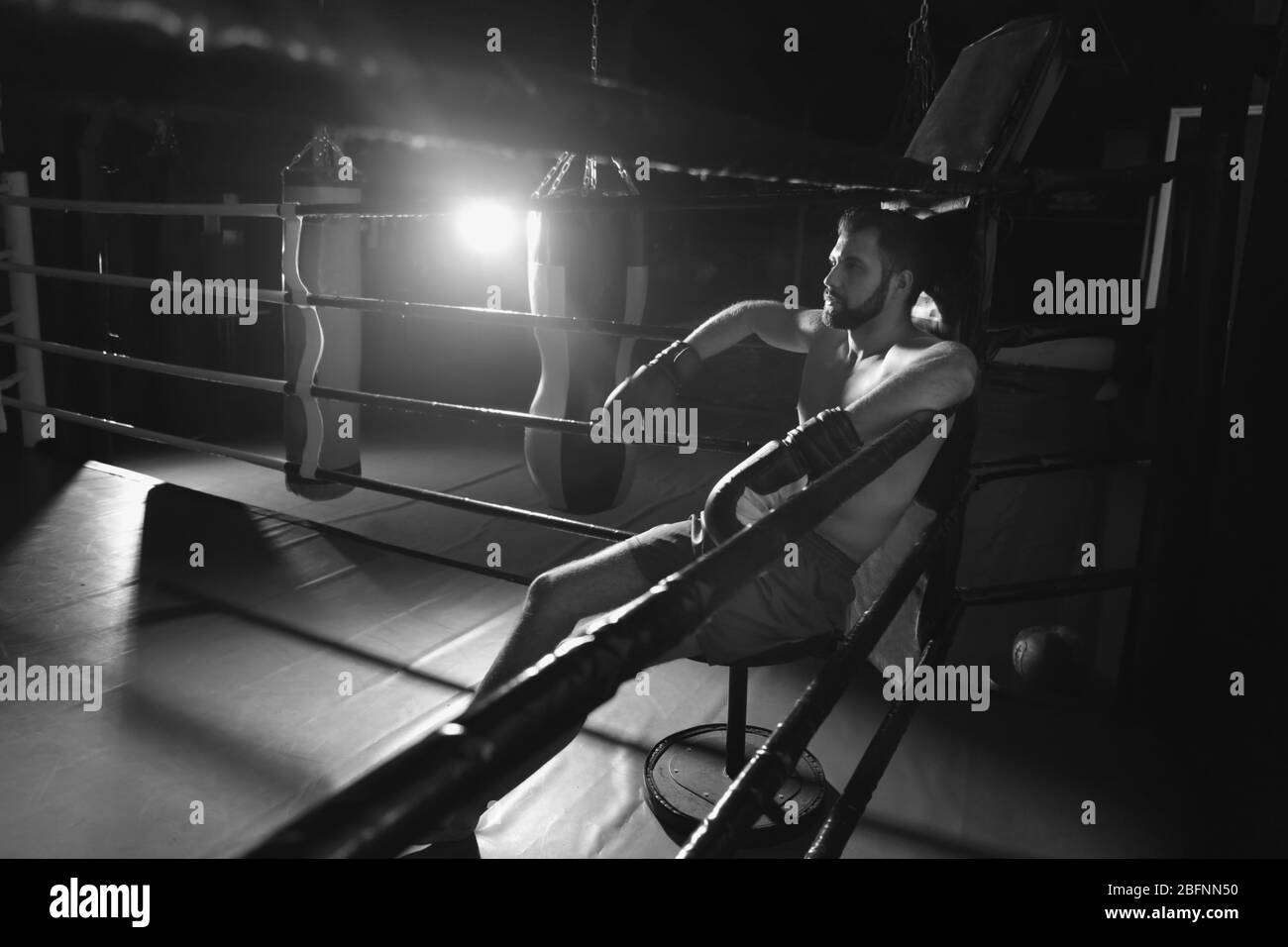 Professional boxer having break during training in ring Stock Photo - Alamy