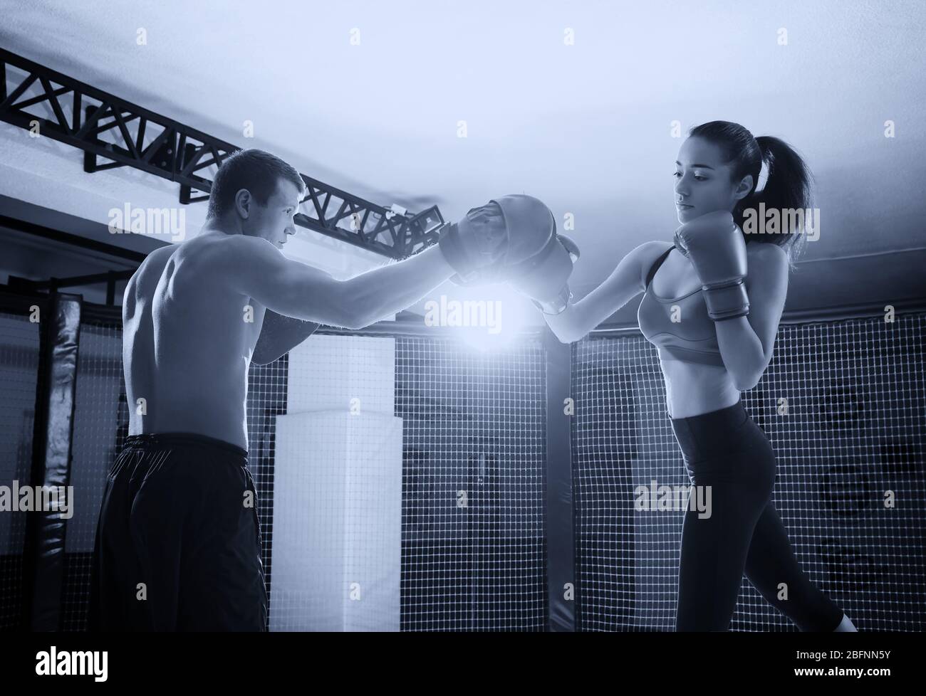 Woman training with coach during boxing classes in gym Stock Photo - Alamy