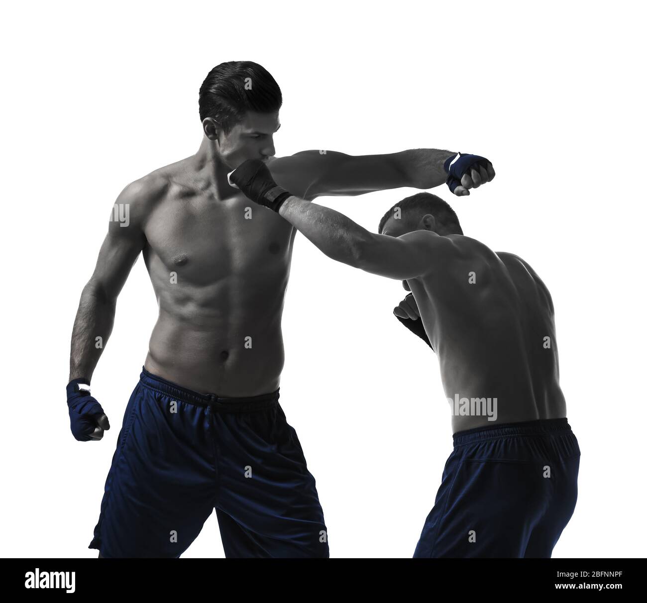 Young boxers fighting on white background Stock Photo - Alamy
