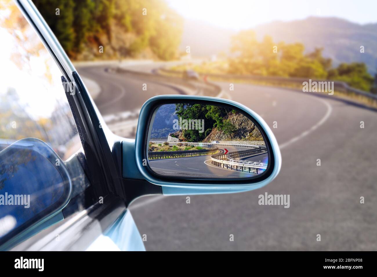 Reflection of modern highway in car side mirror on sunny day Stock ...
