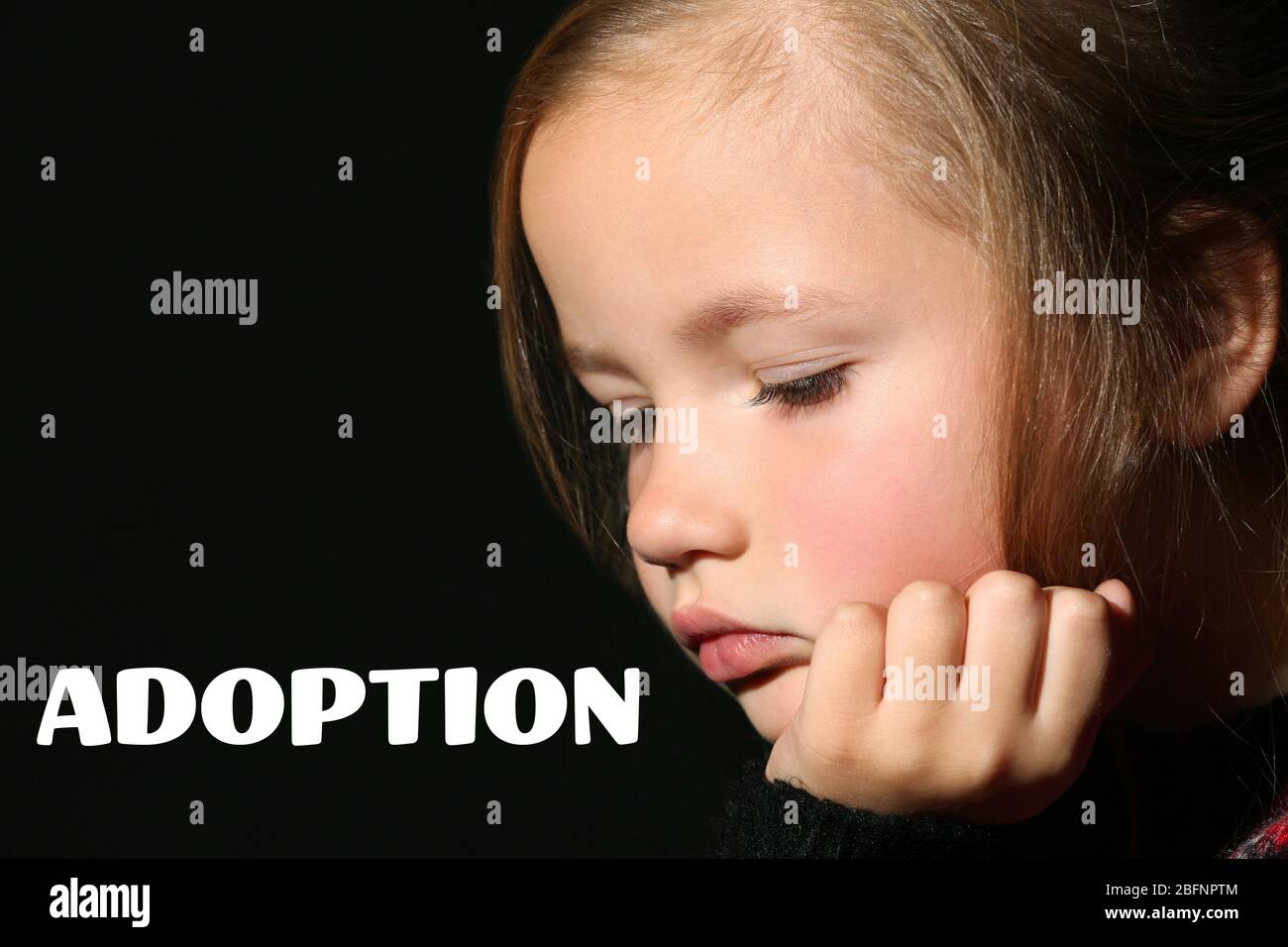 Adoption concept. Sad little girl on black background Stock Photo - Alamy