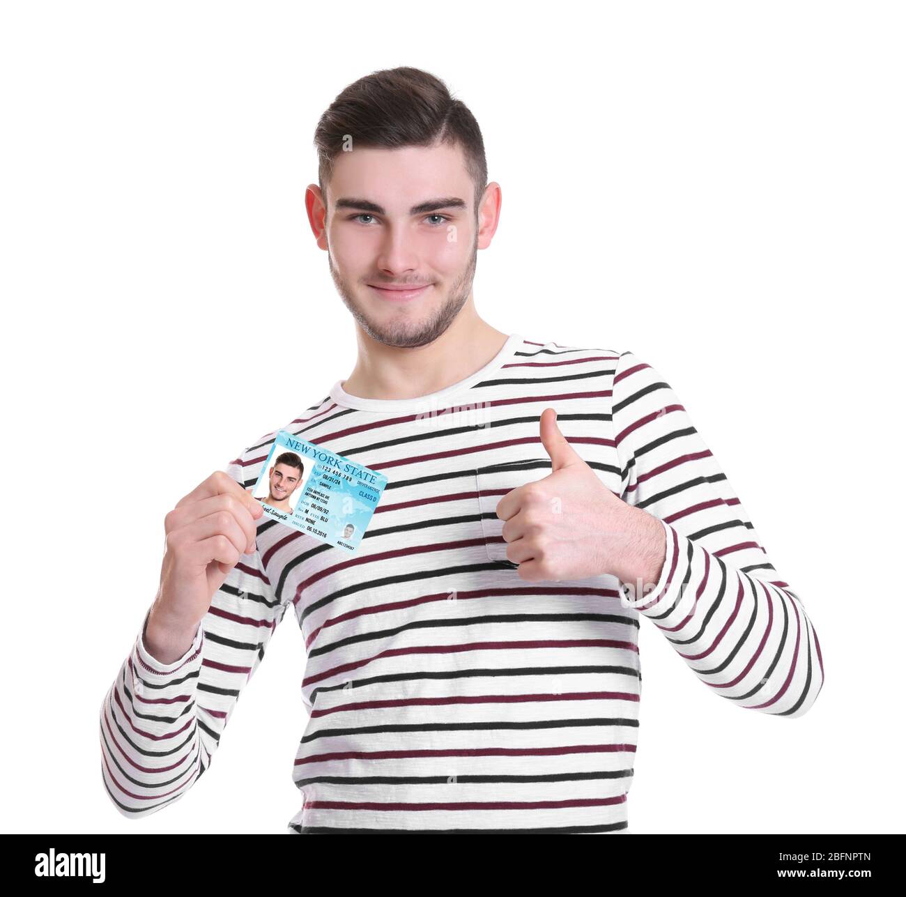 Man with driving license on white background Stock Photo - Alamy