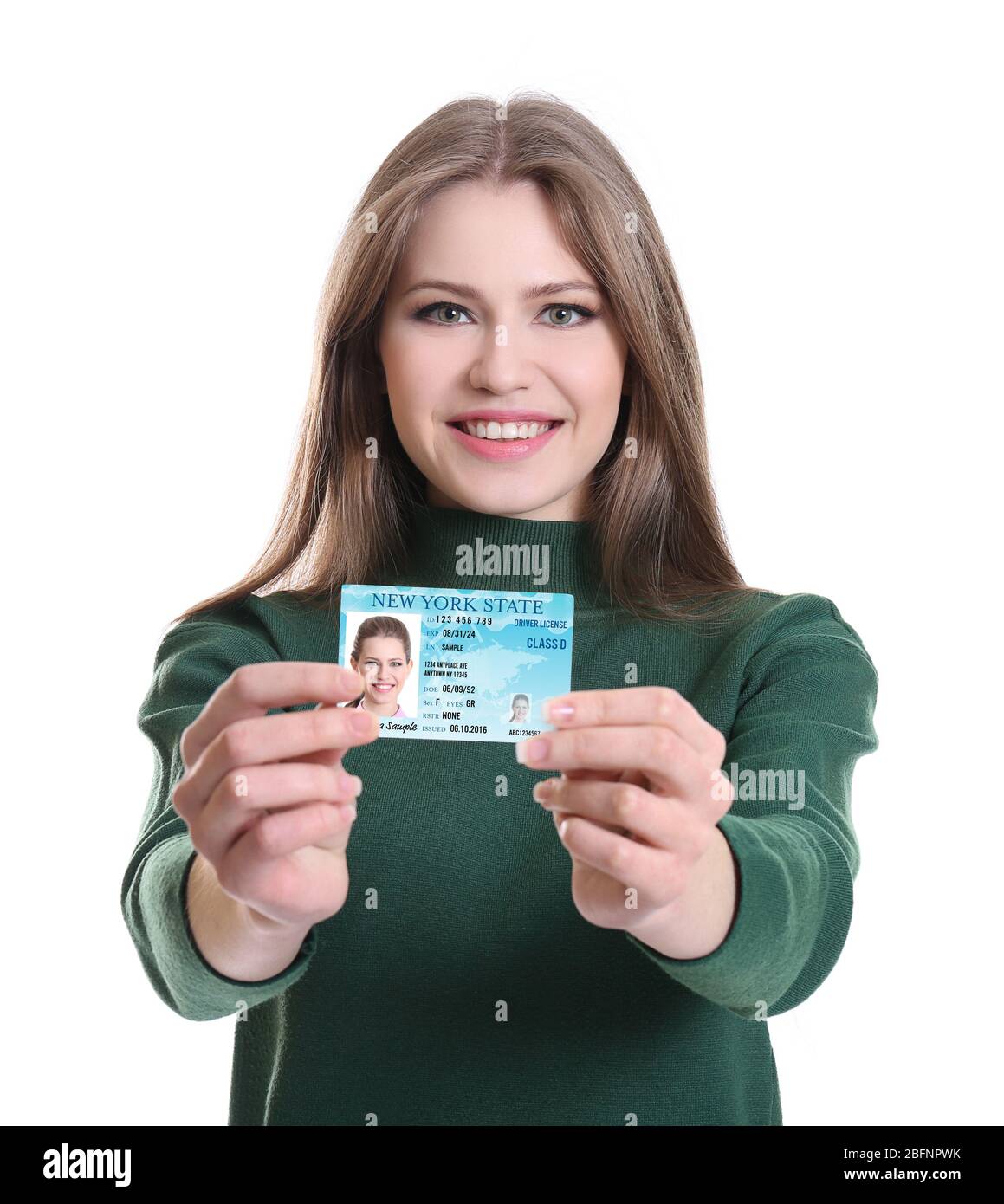 Woman with driving license on white background Stock Photo - Alamy