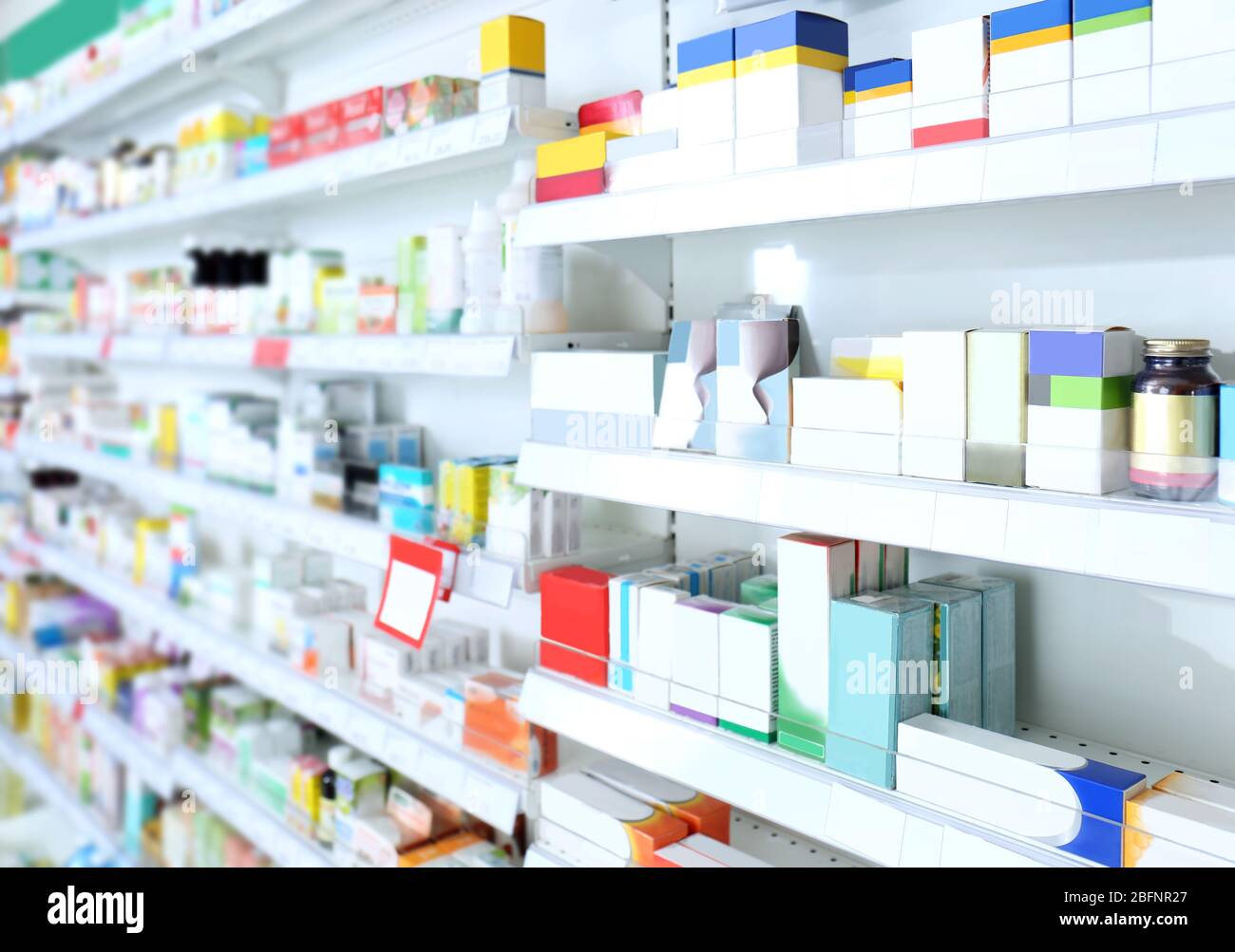 Various products on shelves at store Stock Photo - Alamy