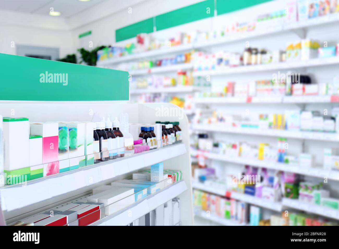 Various products on shelves at store Stock Photo - Alamy