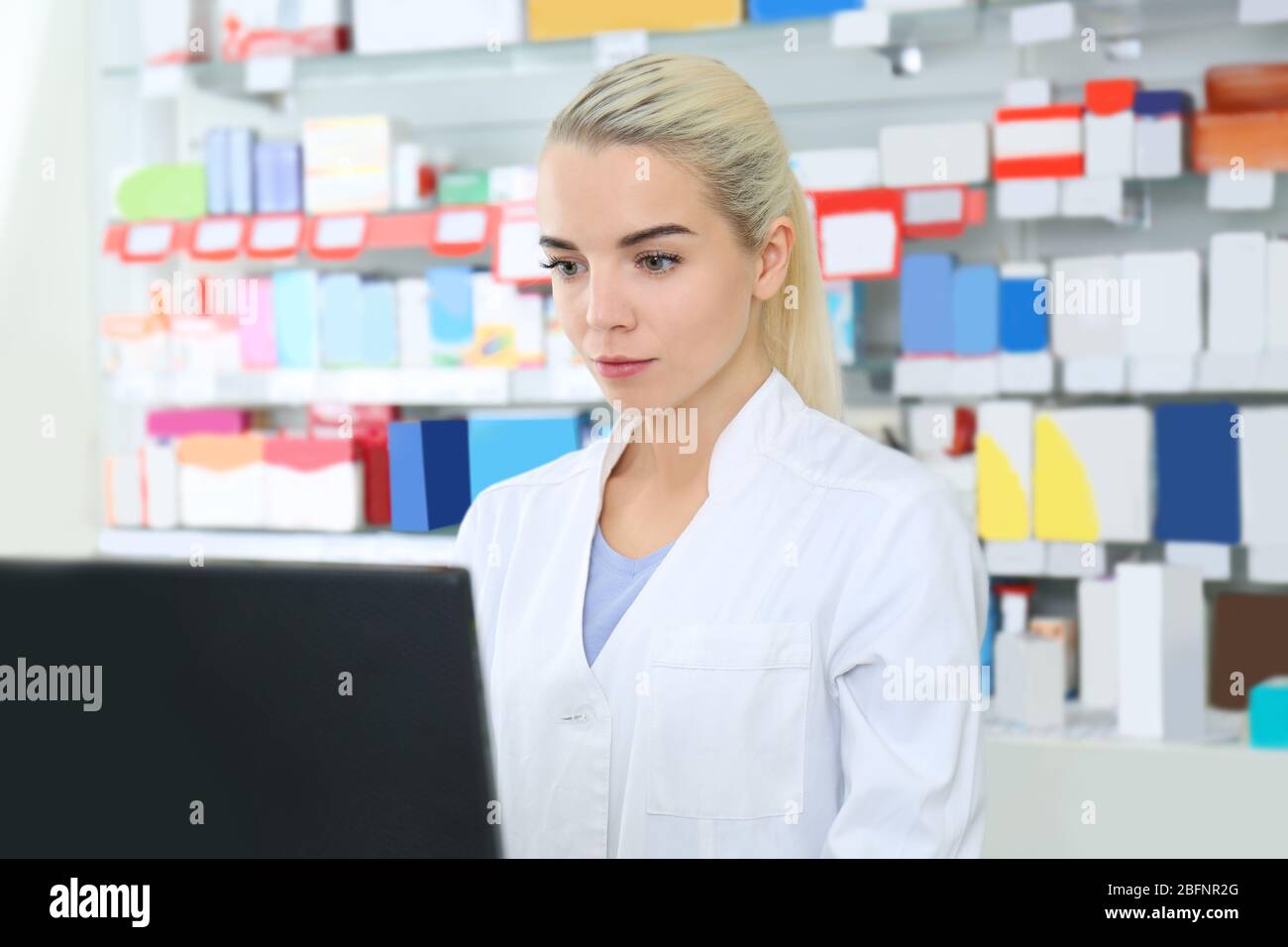 Female shop assistant at work Stock Photo - Alamy