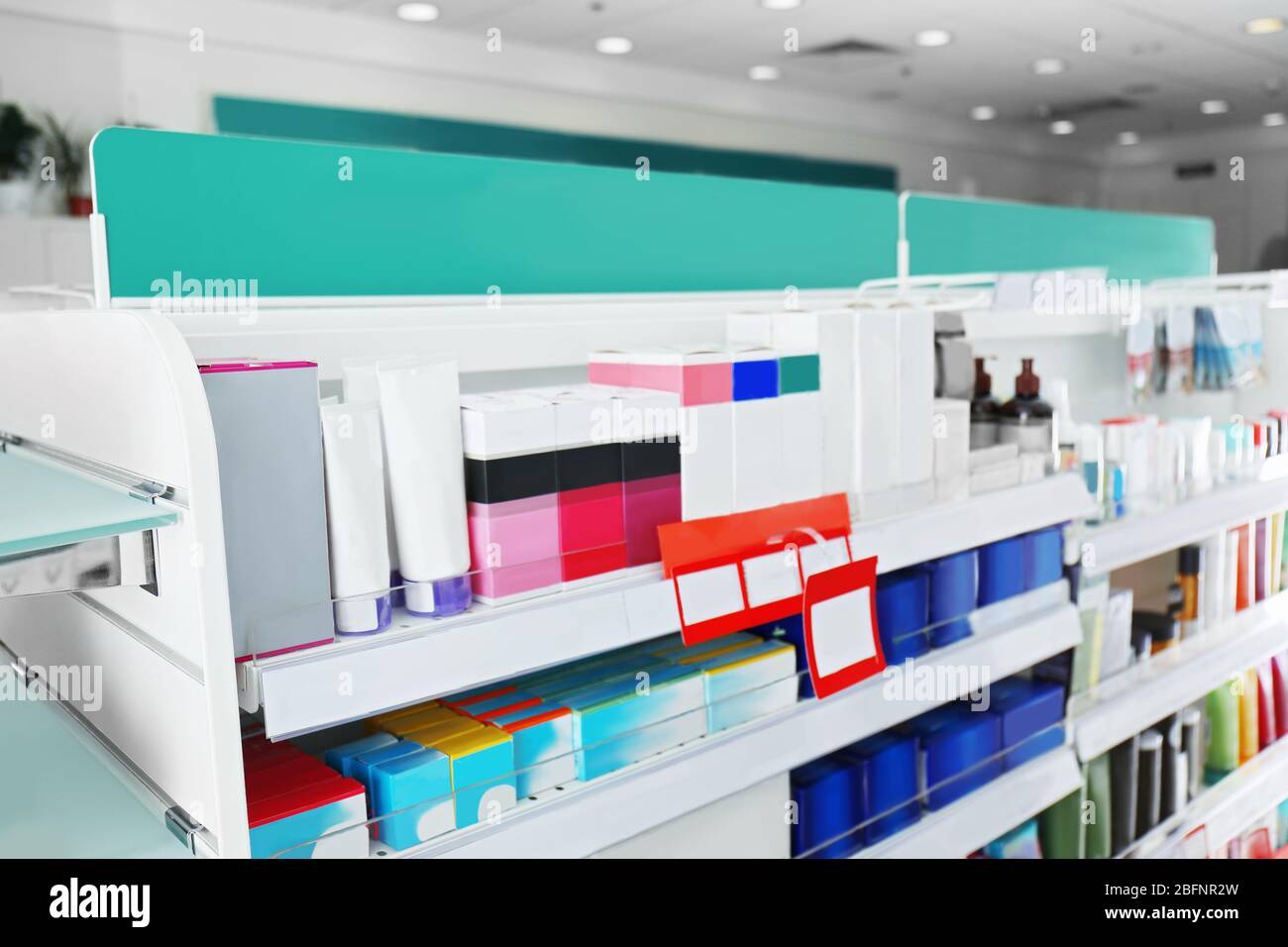 Various products on shelves at store Stock Photo - Alamy