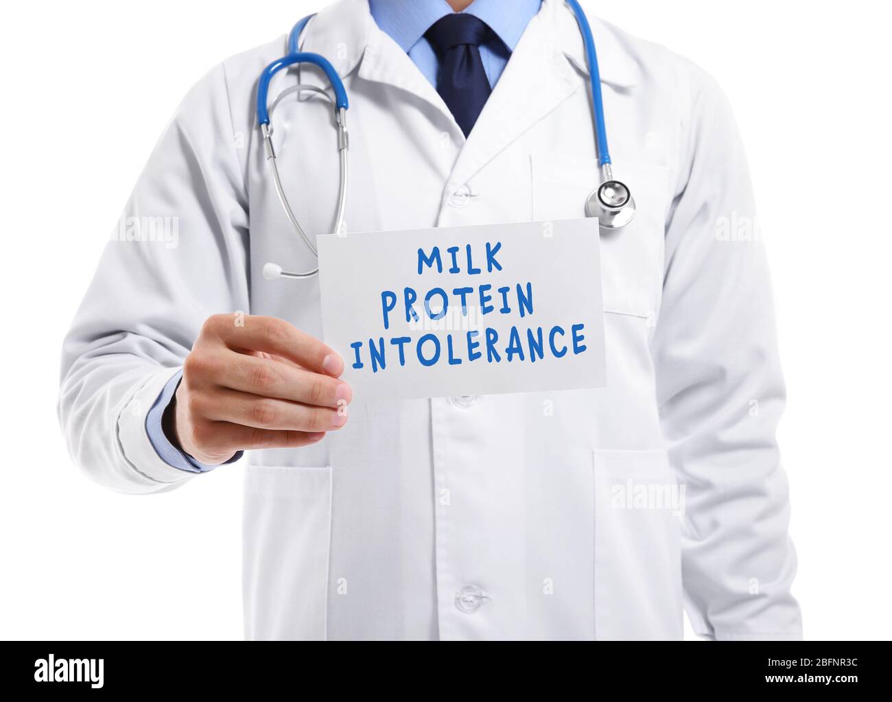 Health care concept. Doctor holding card with text MILK PROTEIN ...
