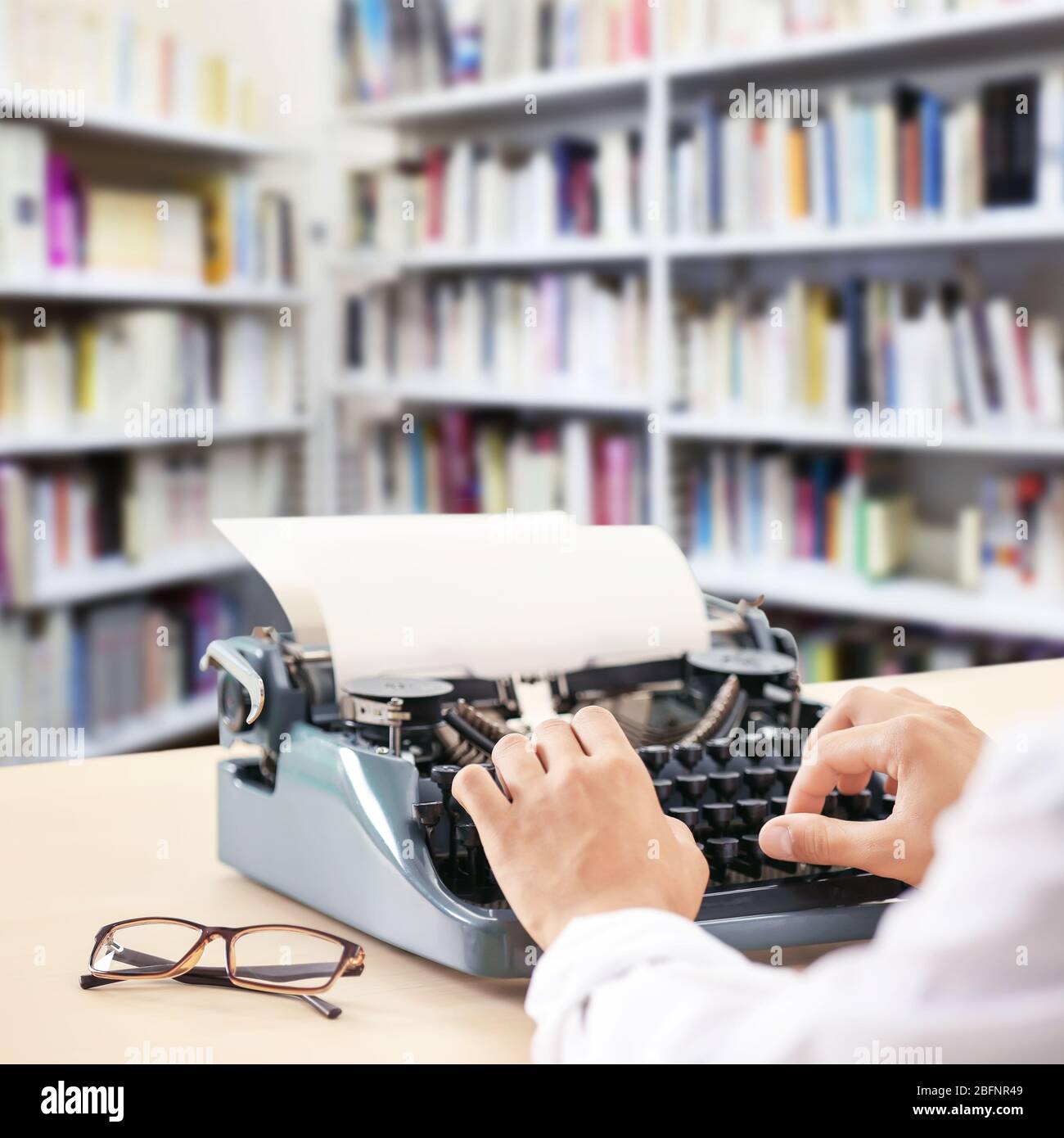 Hands on typewriter machine in hi-res stock photography and images - Alamy