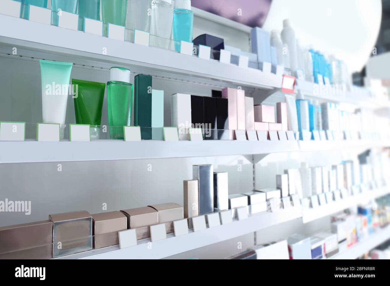 Various products on shelves at store Stock Photo - Alamy